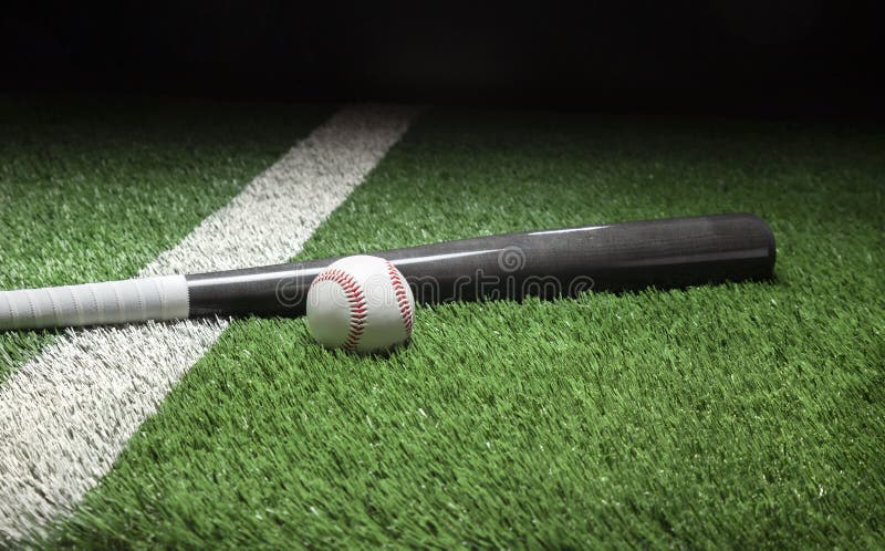 Gray Baseball Bat and Ball on Field with Stadium Lights Stock Image ...