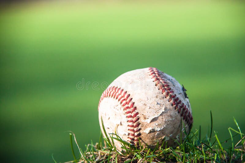Baseball on a green field stock photo. Image of athletics - 64640136