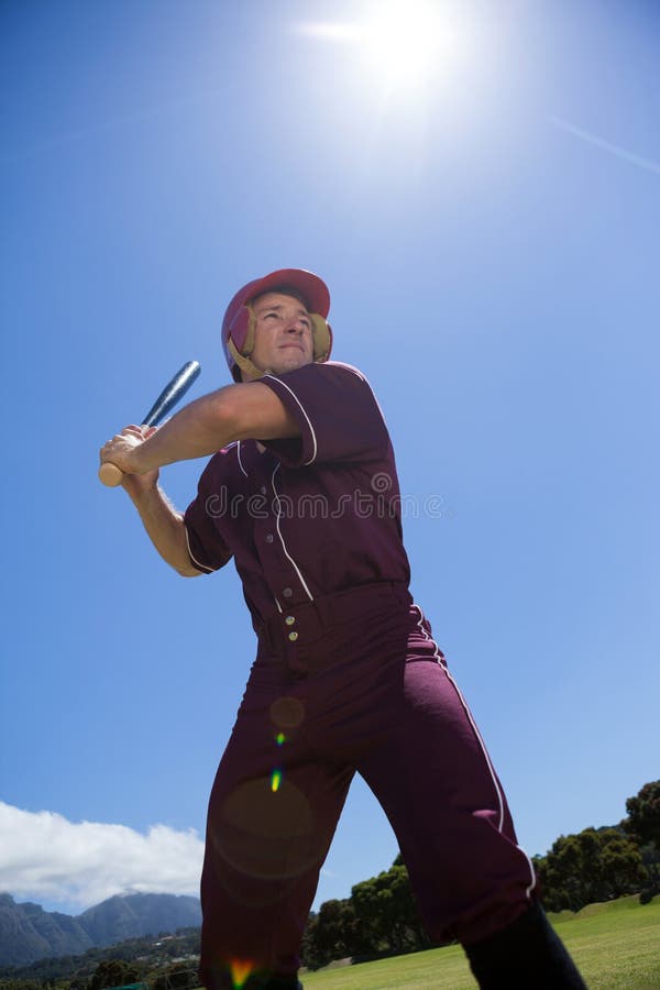 Baseball Player with Bat Against Sky on Sunny Day Stock Photo - Image ...