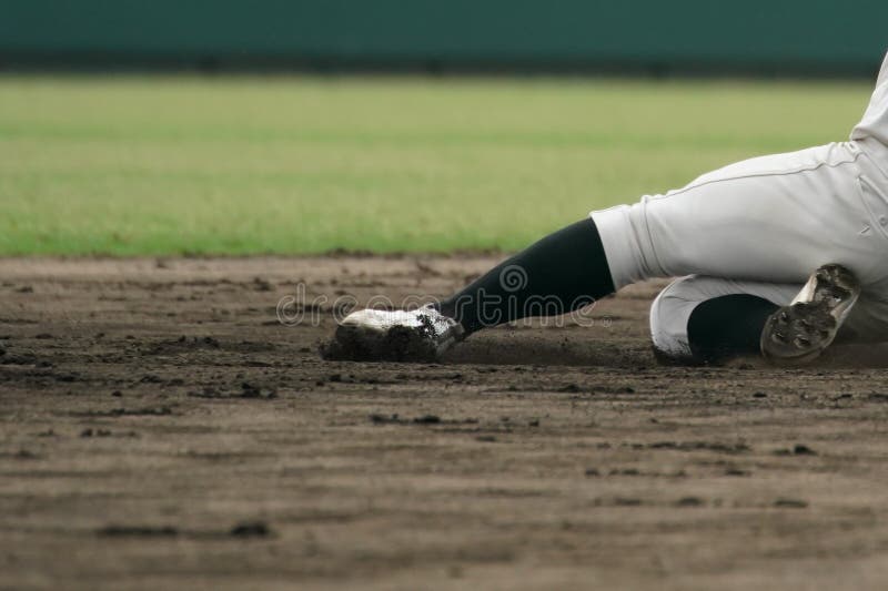 Baseball Player Sliding into a Base Stock Photo - Image of judge ...