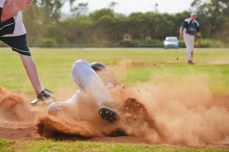 Sliding into Home Plate stock image. Image of excitement - 574973