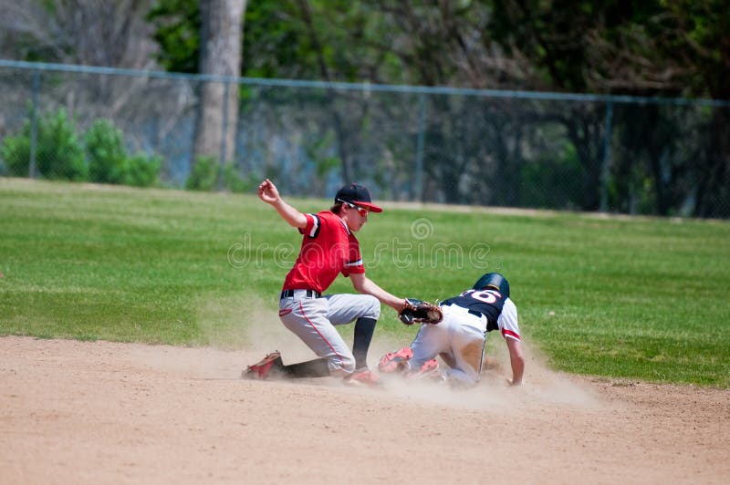 Teenage Baseball Shortstop Tagging Player Out at Second Base. Stock ...