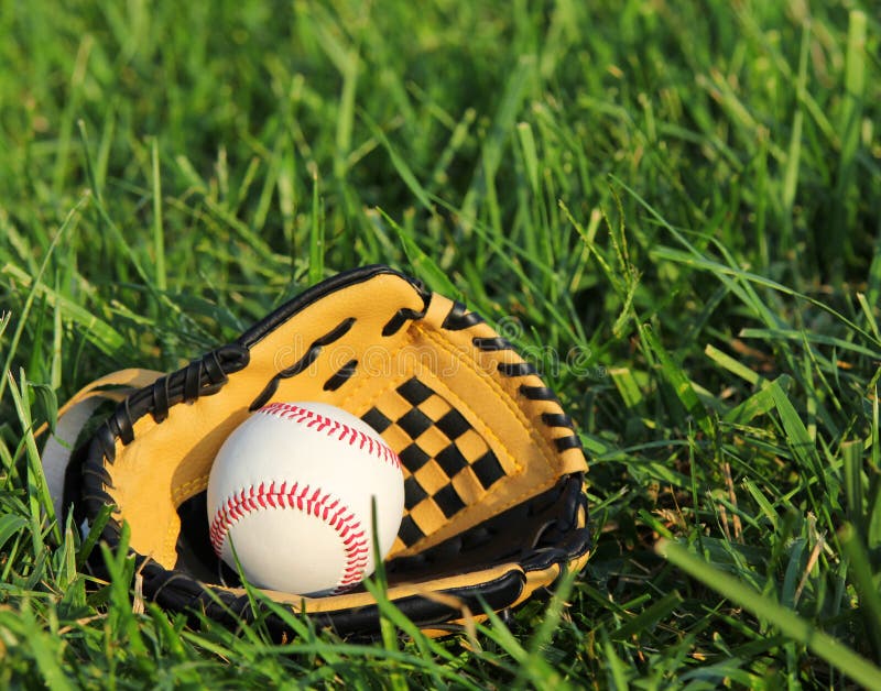 Baseball in Yellow Glove on the Grass Stock Photo - Image of glove ...