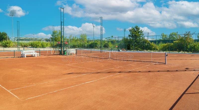 Baseline and Net of an Empty Clay Tennis Court on a Sunny Day Stock ...