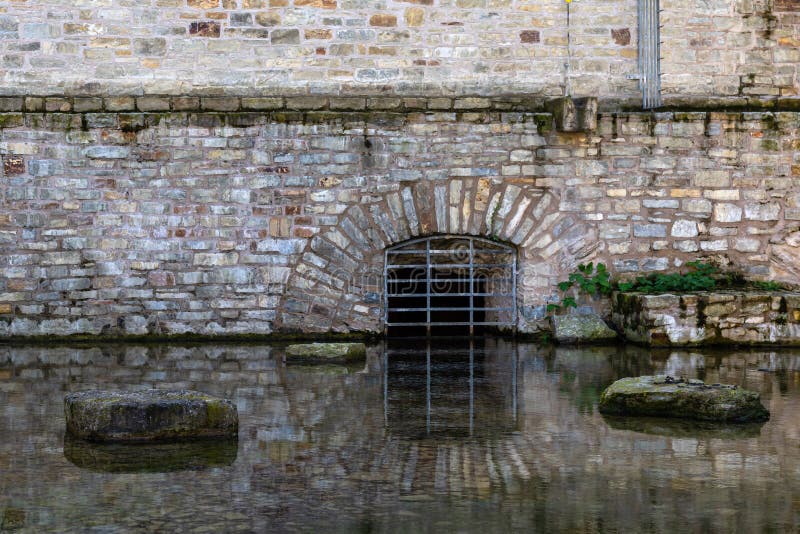 The Basement Curtained Window of an Ancient Building is Reflected in ...