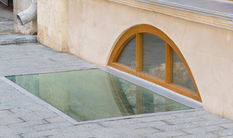 Window at sidewalk level stock image. Image of detail - 270387369