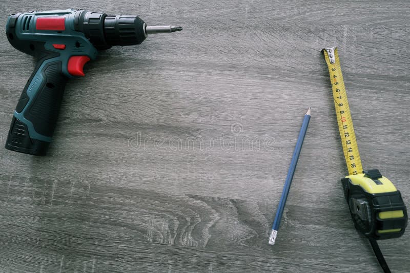 Basic Construction Tools Set on Wooden Background. Electric Screwdriver ...
