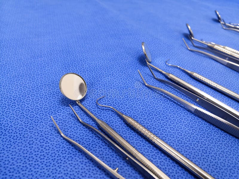 Basic Dental Instruments Set Arranged on Blue Wrapping Sheet Stock ...