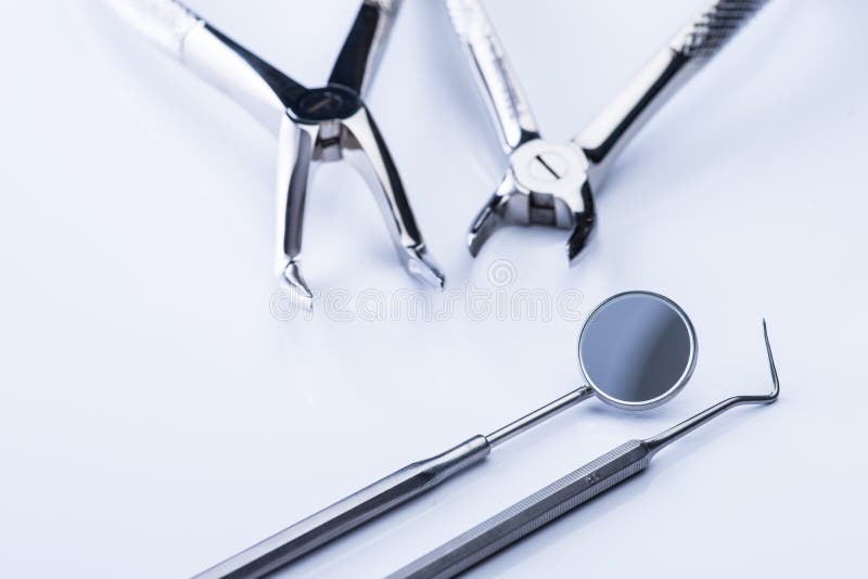 Basic Dental Tools on White Table Stock Photo - Image of extractor ...