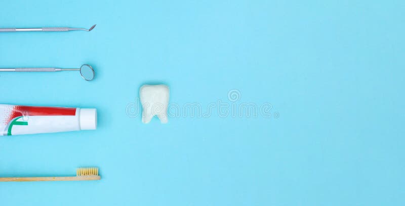 Basic Dentist Tools , Toothbrush, Toothpaste and Tooth Model on Blue ...