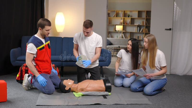 Basic Emergency Training in Group, Man Showing Artificial Lung ...