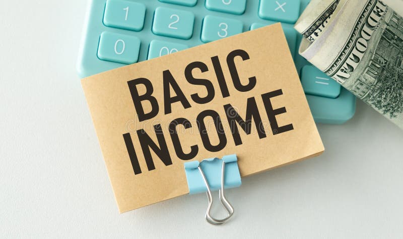 BASIC INCOME Text on a Notebook on Beige Paper and Calculator Stock ...
