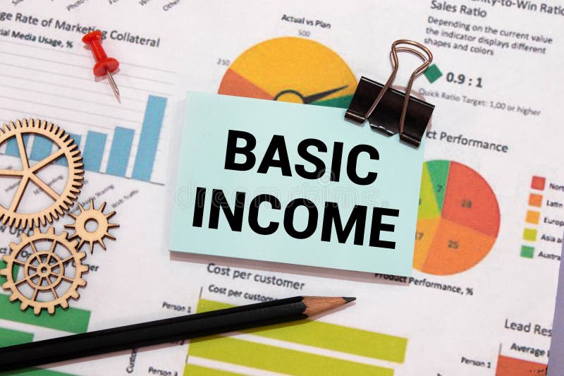 BASIC INCOME Text on a Notebook on Green Paper Stock Photo - Image of ...