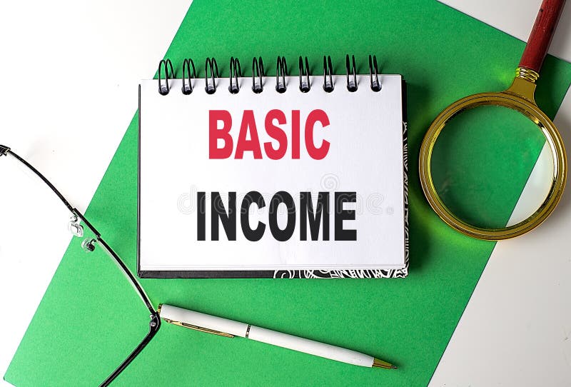 BASIC INCOME Text on Notebook on Green Paper Stock Image - Image of ...