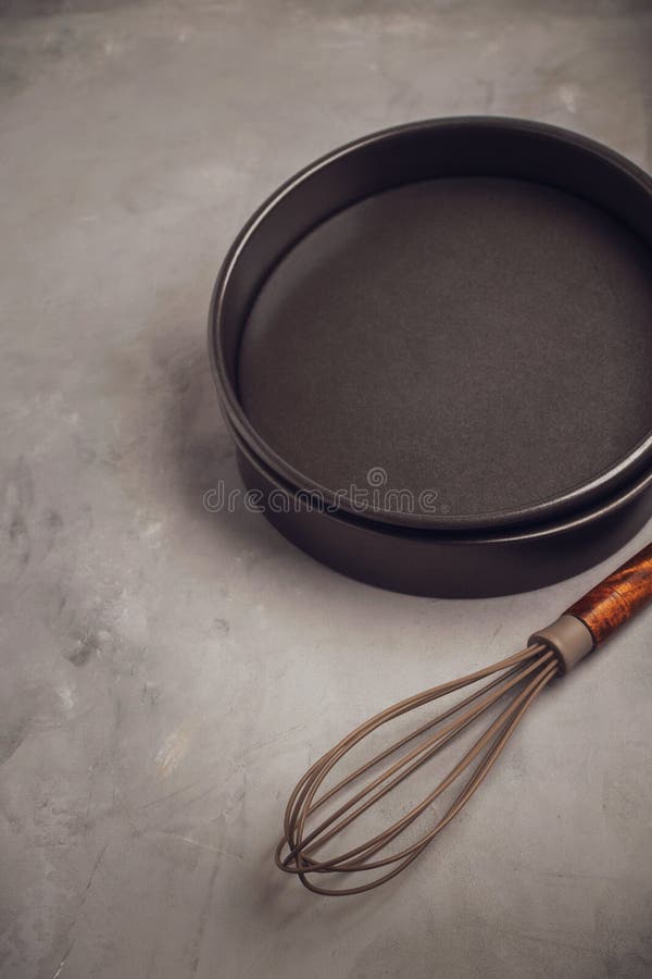 Basic Kitchen Utensils with Cake Molds on Gray Stone Background with ...