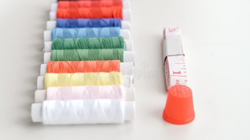 Colorful threads on spools stock photo. Image of craft - 84010800