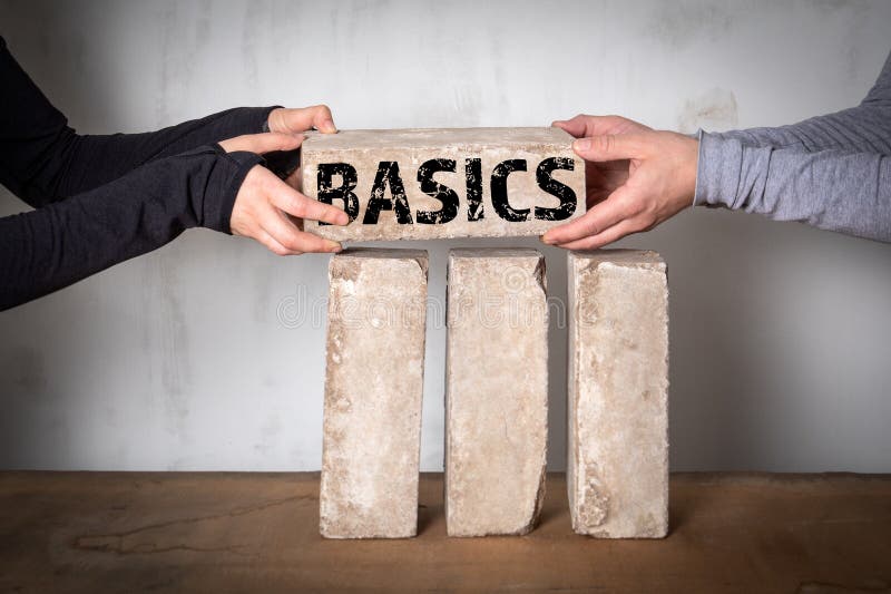 Basics Concept. Stack of White Bricks on a Wooden Table Stock Photo ...
