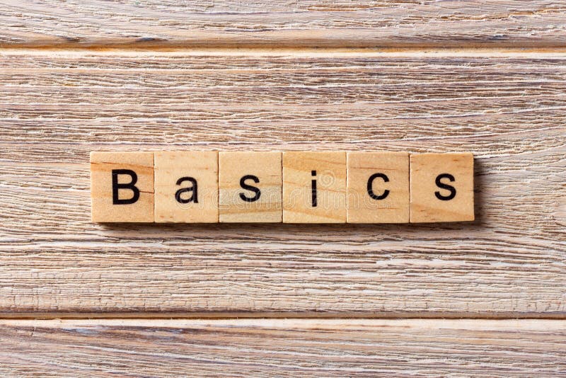 Back To Basics Word Written on Wood Block. Back To Basics Text on Table ...