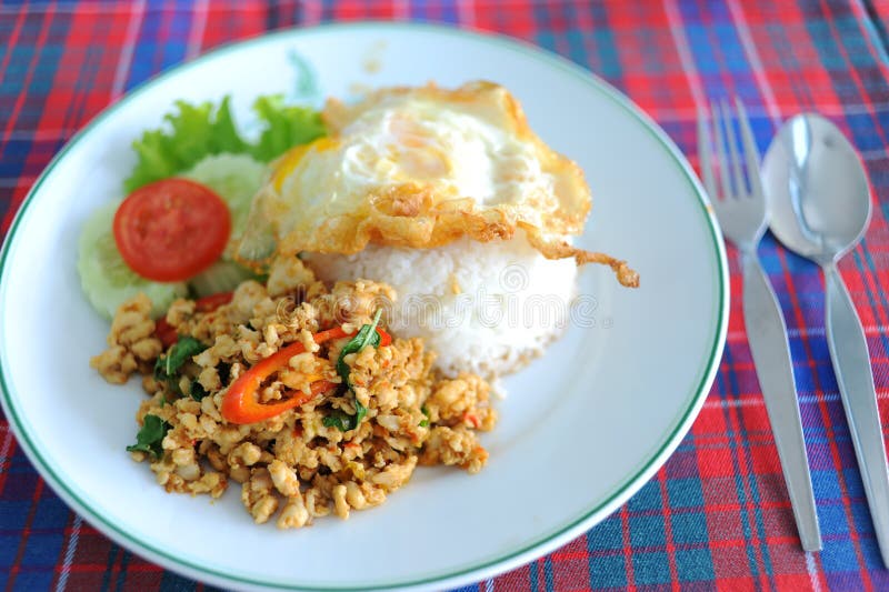 Basil Chicken Fried Rice Recipe Stock Photo - Image of omelette, table ...