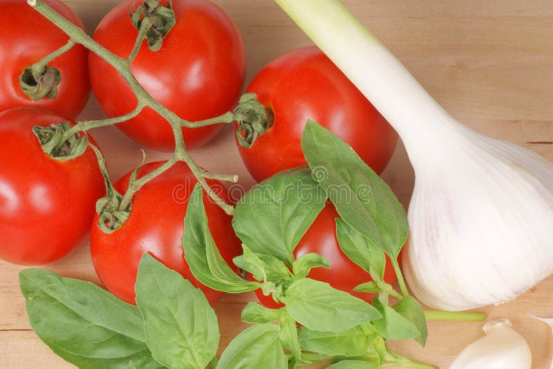 Basil, garlic and tomatoes stock photo. Image of cuisine - 14439164