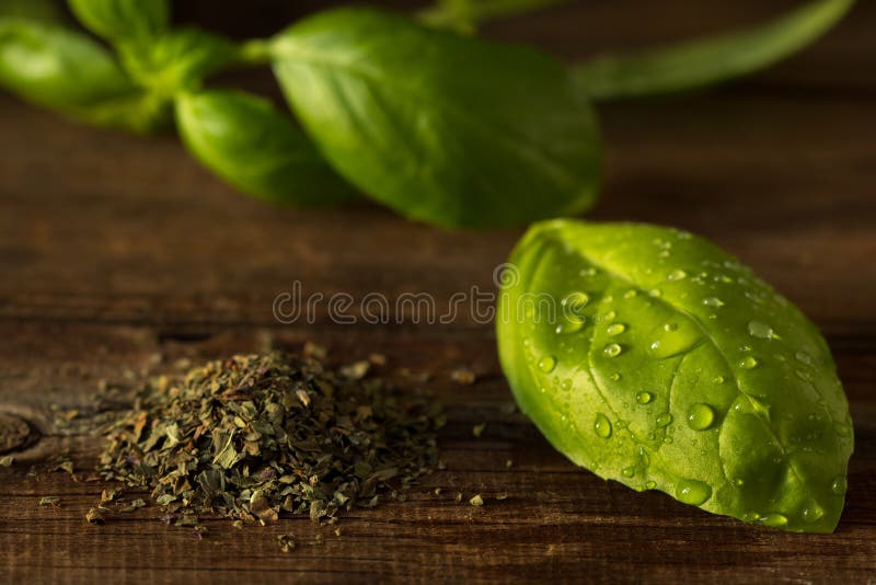 Basil Leaves and Dried Basil on an Old Wooden Table. Stock Photo ...