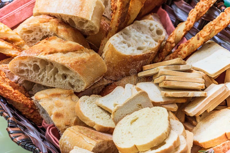 Basket of Bread with Different Types of Cheese on the Table Stock Photo ...