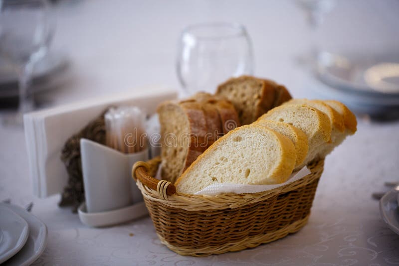 Basket of Bread on the Table Stock Image - Image of design, tablecloth ...