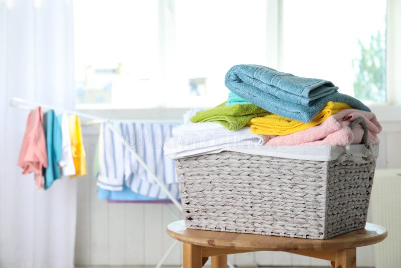 Basket with Clean Laundry on Table at Home Stock Photo - Image of full ...