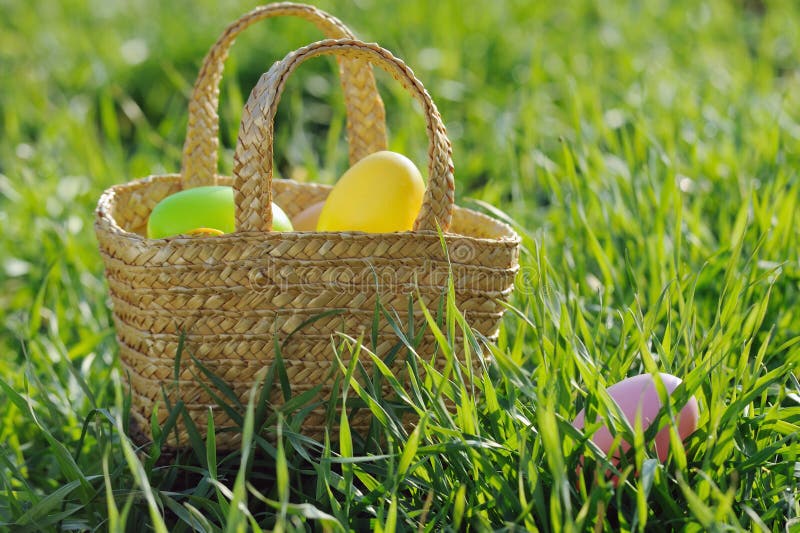 Basket Filled with Easter Eggs in Green Grass Stock Image - Image of ...