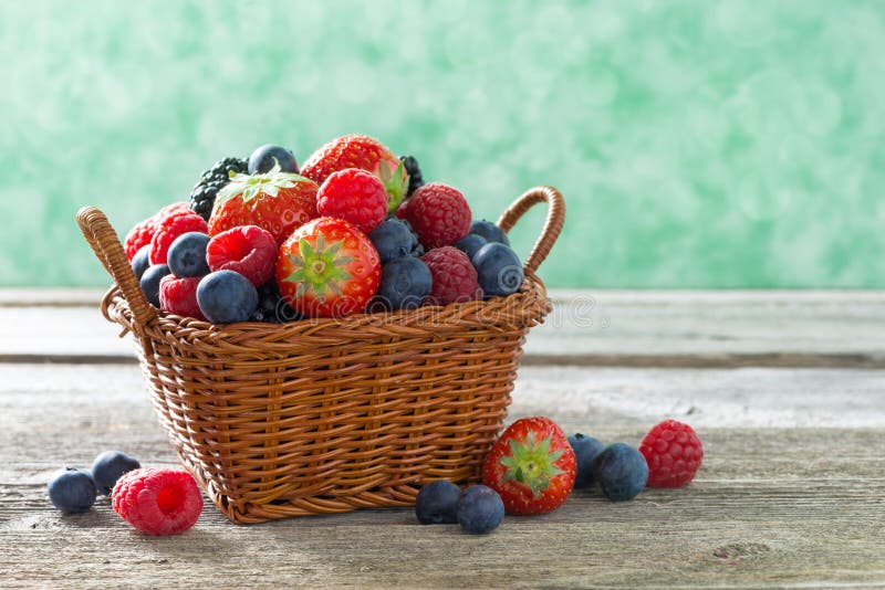 Basket of Fresh Seasonal Berries on Wooden Table, Top View Stock Image ...