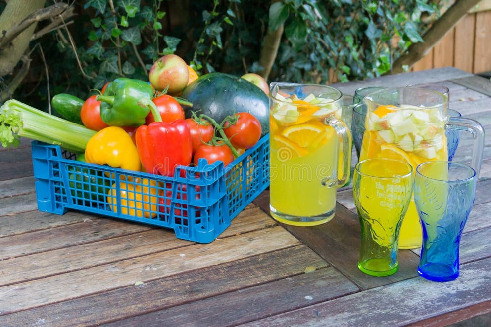 Basket of Fruit with Jug of Orange Squash. Stock Photo - Image of ...