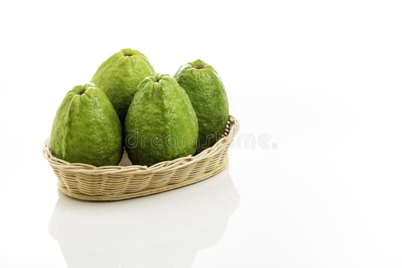 Basket with Red Guavas and Glass with Juice and Pieces of Fruit. Copy ...