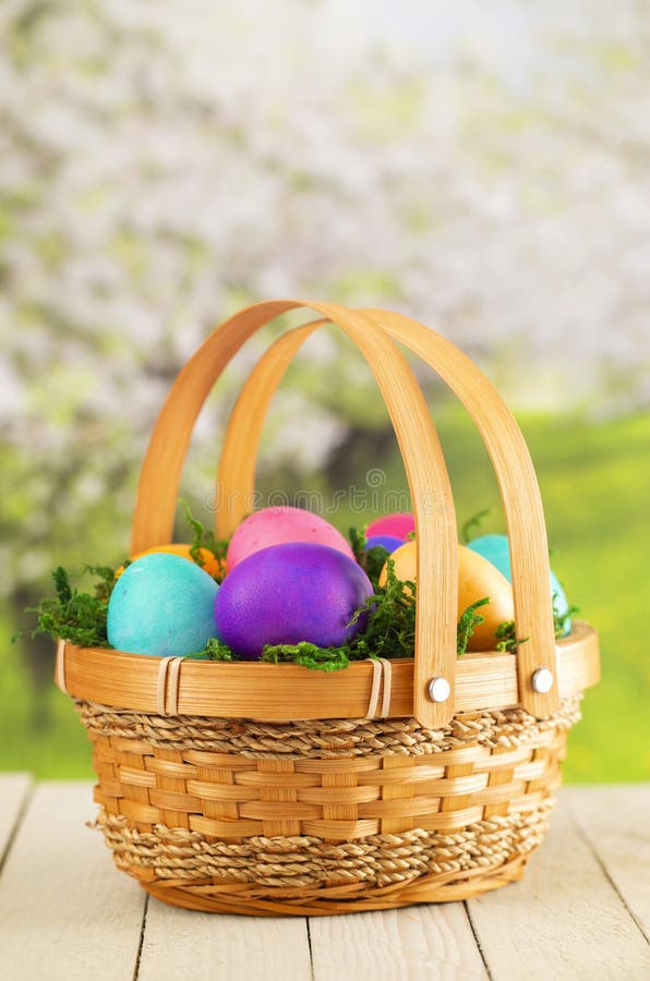 A Basket Full of Colorful Solid Easter Eggs Stock Photo - Image of ...