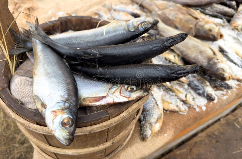 A Basket Full of Fish is on a Table Stock Photo - Image of black ...