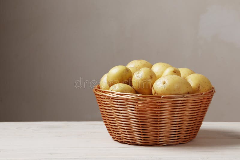 Basket Full of Fresh, Young Potatoes on a Wooden Table Stock Image ...