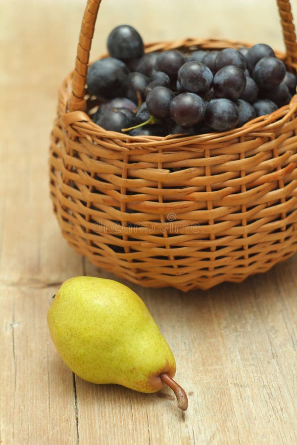 Basket Full of Grapes with Pear Stock Photo - Image of organic, purple ...