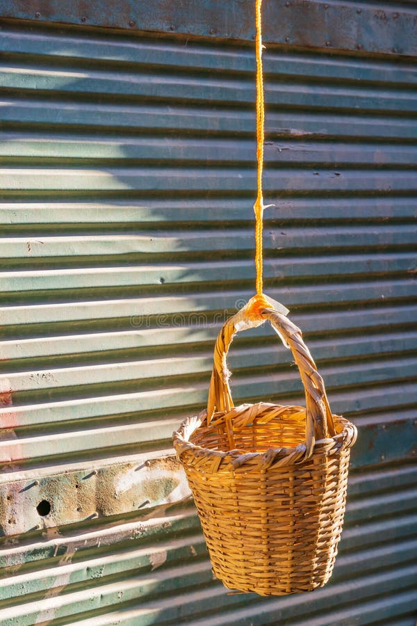 Basket hanging from a rope stock photo. Image of crafts - 258180242