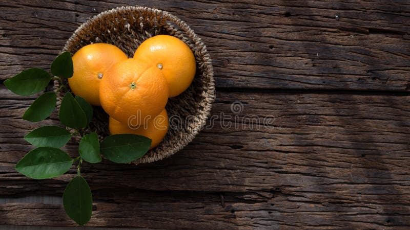 Basket of Orange Fruit Set on Wood Table Stock Image - Image of wood ...