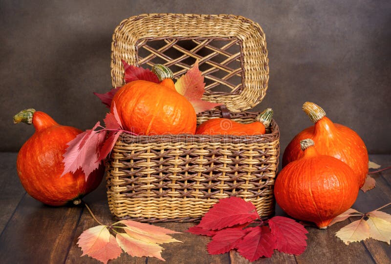 Basket on the Table with Pumpkins and Autumn Leaves Stock Image - Image ...