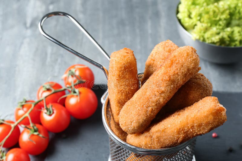Basket of Tasty Crispy Cheese Sticks on Table Stock Photo - Image of ...