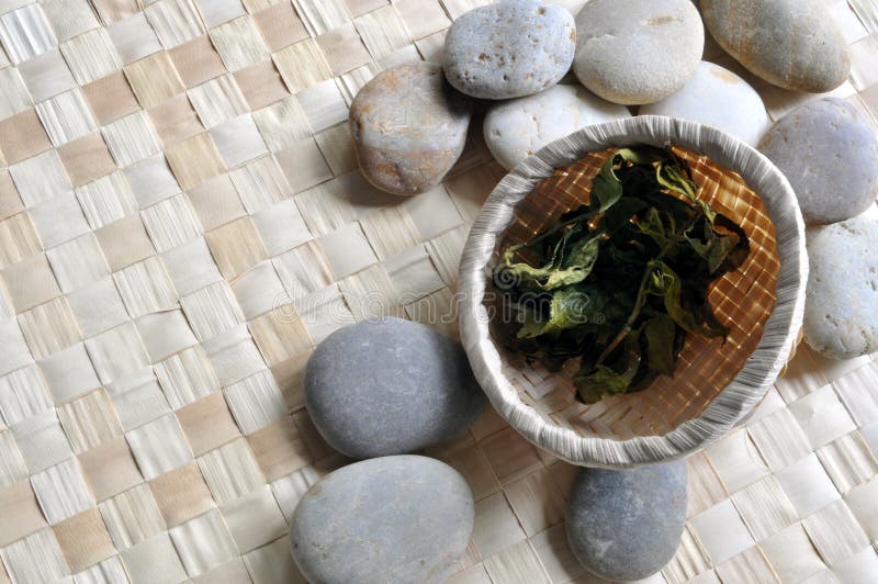 Basket of Tea Leaves on Pebbles Stock Image - Image of bamboo, pebble ...