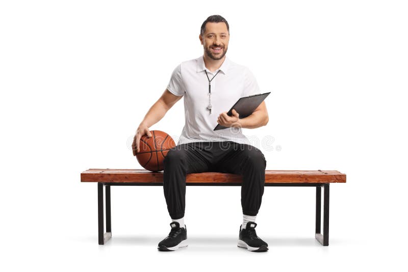 Basketball Coach Holding a Ball and Sitting on a Bench Stock Image ...