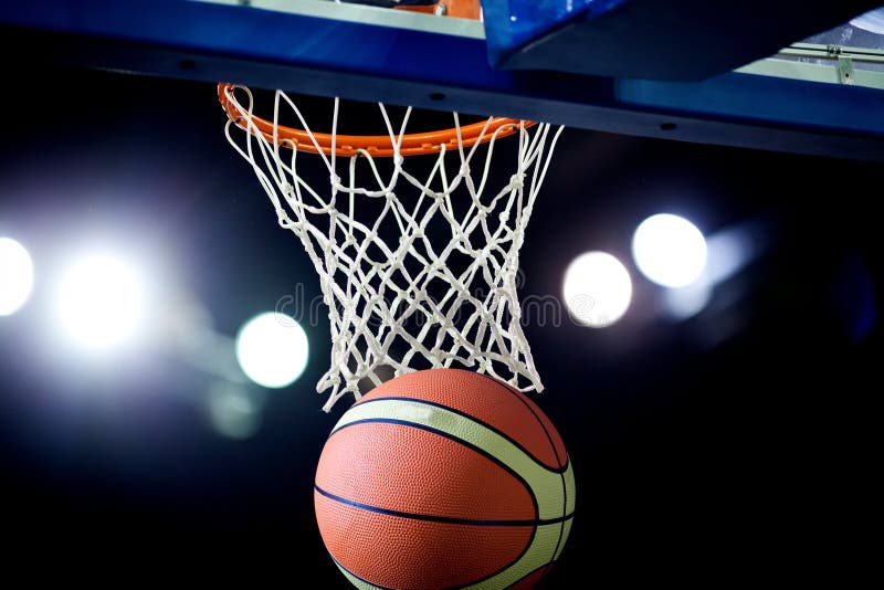 Basketball Going through the Hoop Stock Photo - Image of ball, action ...