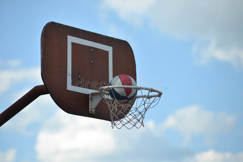 Basketball Going in Net on Blue Sky Outdoors Stock Photo - Image of ...