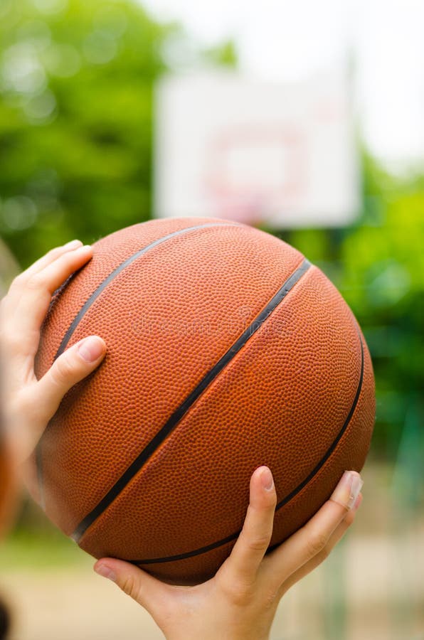 Basketball in hand stock photo. Image of physical, basketball - 43030944