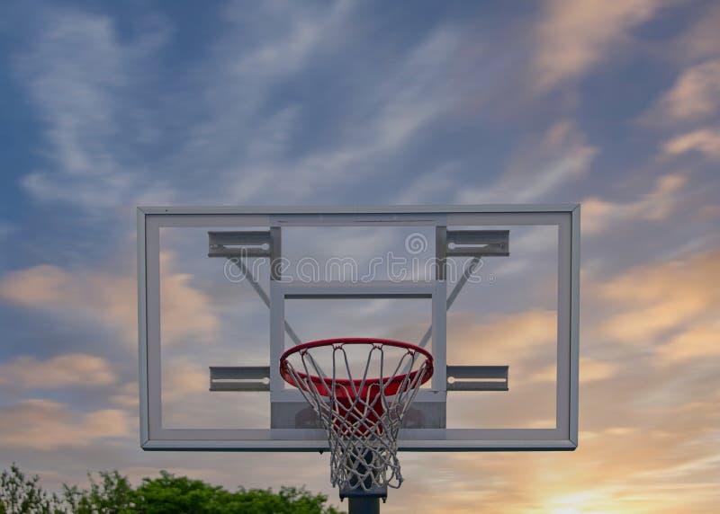 Basketball Hoop Against a Setting Sky Stock Photo - Image of hints ...
