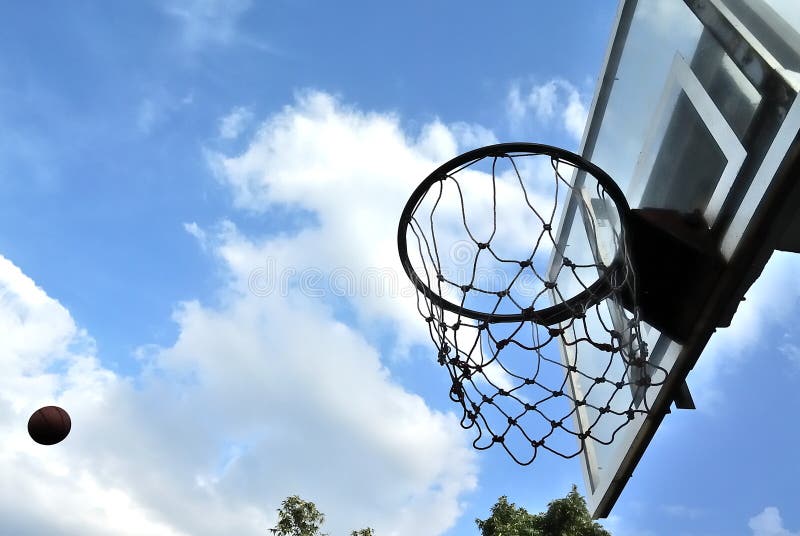 Basketball Hoop with Ball in the Air and Clouds Stock Photo - Image of ...