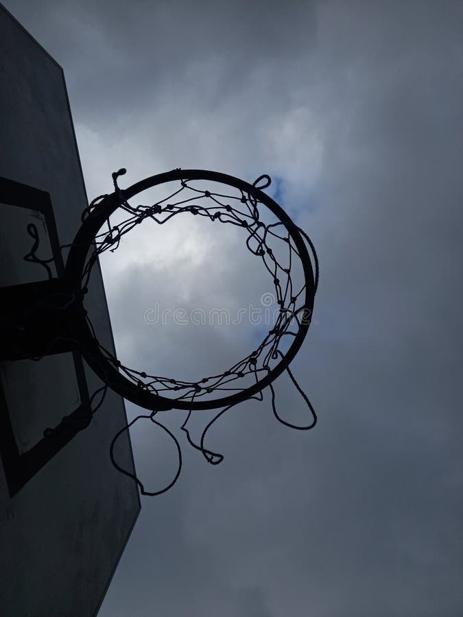 A Basketball Hoop Barely Visible in Dark Lighting, Creating a Dramatic ...