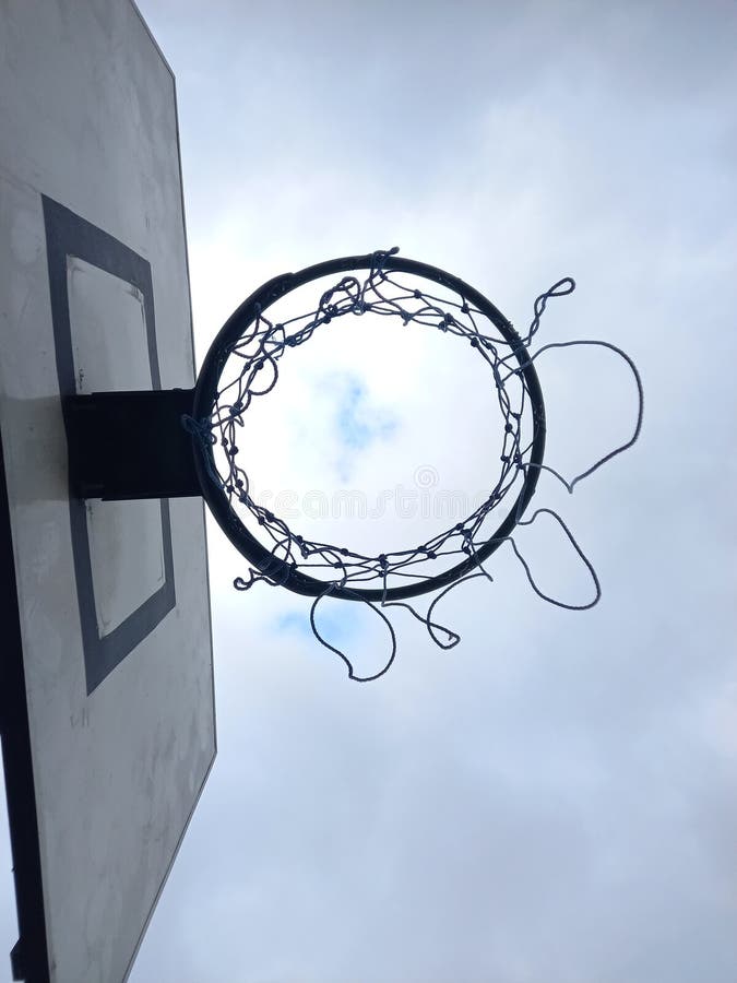 Basketball Hoop Under Overcast Skies Stock Image - Image of overcast ...