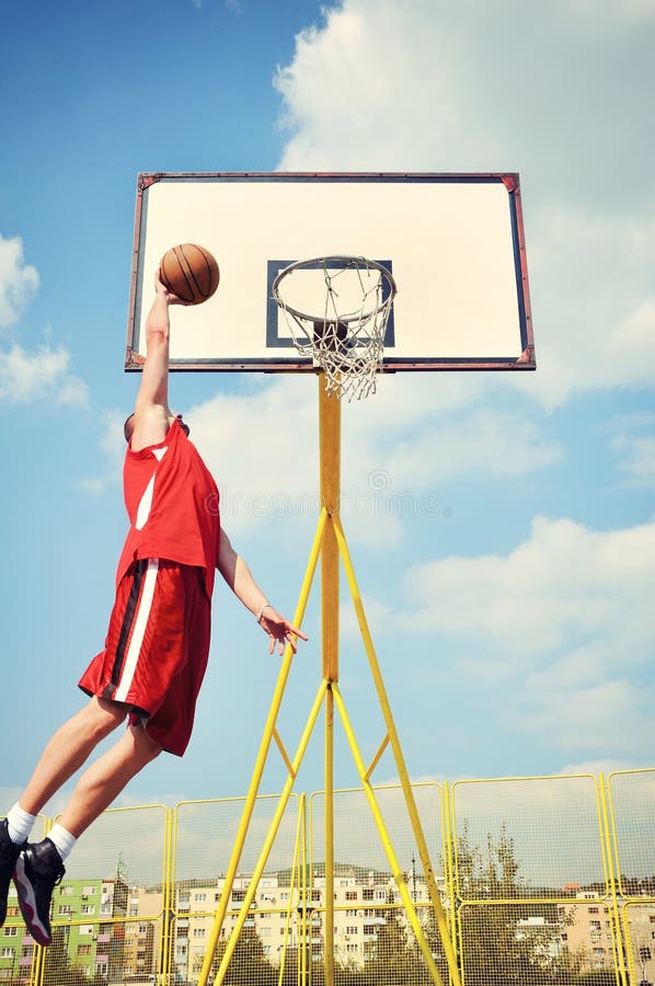 Basketball Player in Action Flying High and Scoring Stock Photo - Image ...